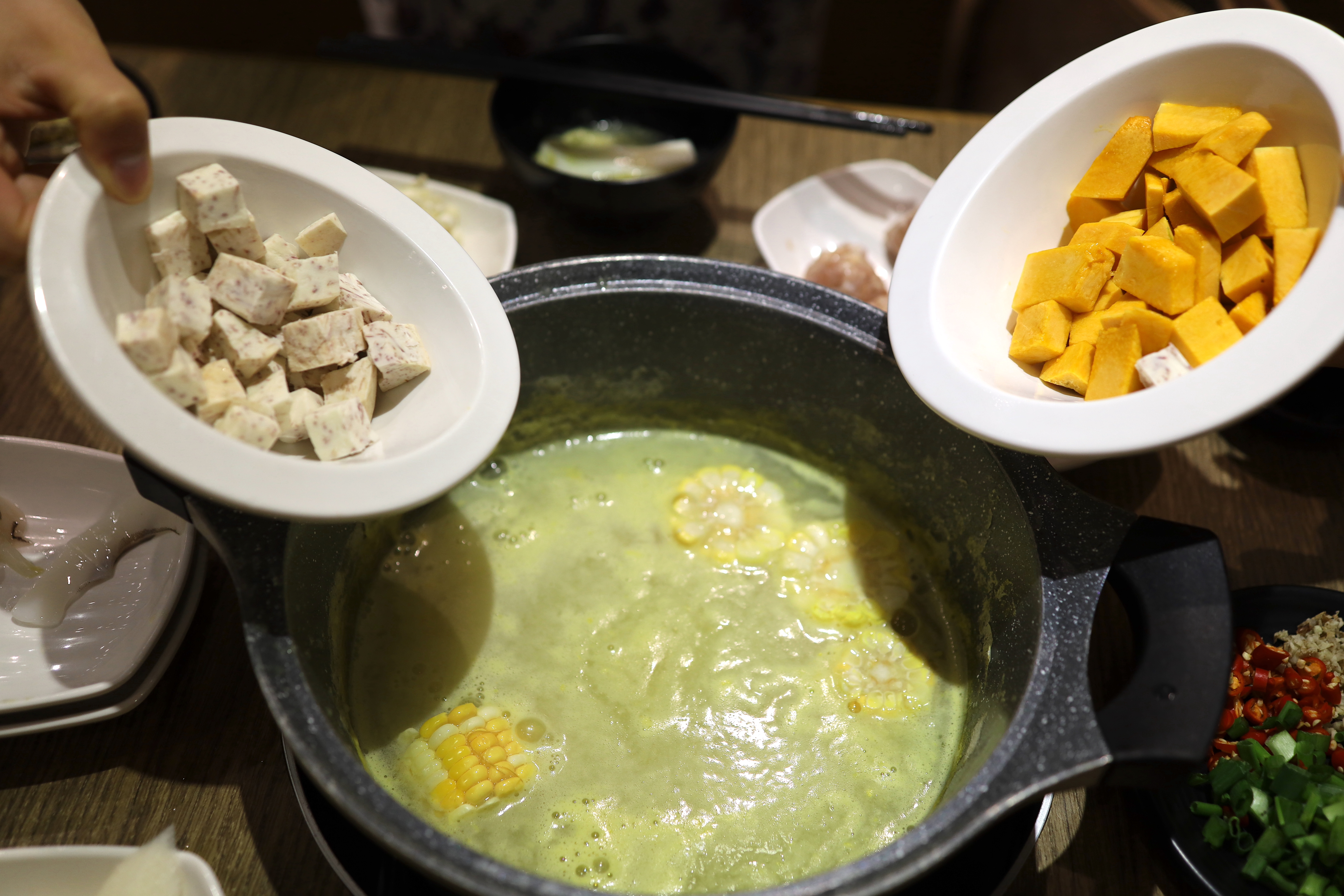 The Cosmopolitan (Sham Shui Po) - Experience a Fusion of Flavors with Congee Base Hotpot